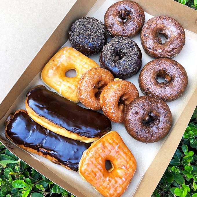 A box of vegan donuts proving that plant-based eating doesn't mean sacrificing life's sweetest pleasures.
