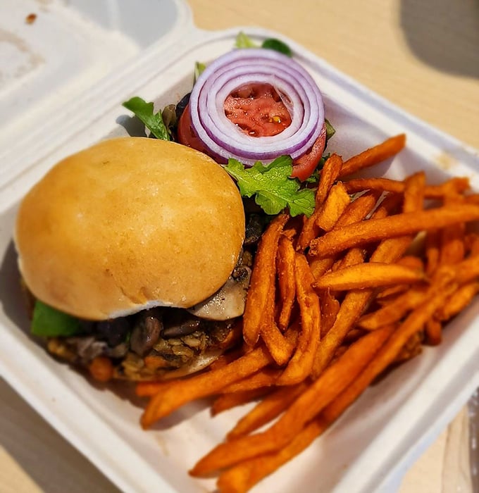 This isn't just a veggie burger&mdash;it's proof that plant-based can be indulgent. Those sweet potato fries are the supporting actors stealing the show.