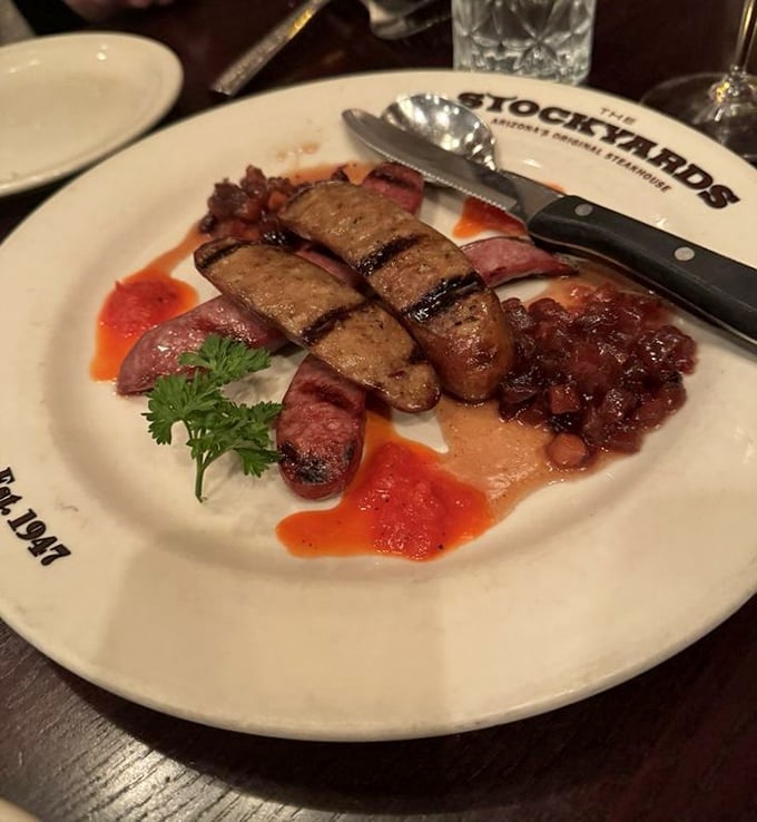 Grilled venison sausage with vibrant sauces brings wild game sophistication to the table. A taste of the frontier with modern culinary finesse.