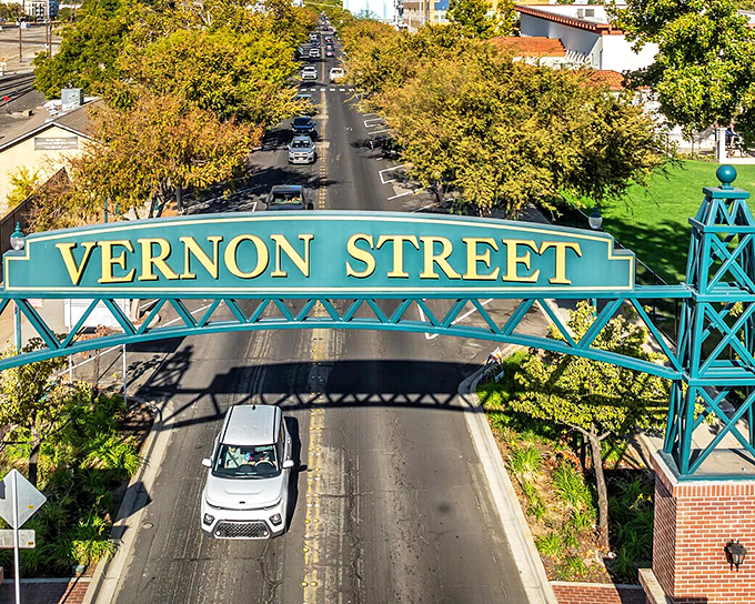 The Vernon Street archway welcomes you to downtown like a friendly neighbor who always remembers your name but never borrows your lawn mower.