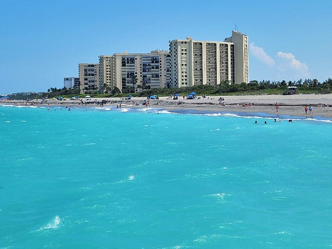 Beachfront high-rises that somehow don't ruin the vibe. That turquoise water makes everything look good, even concrete.
