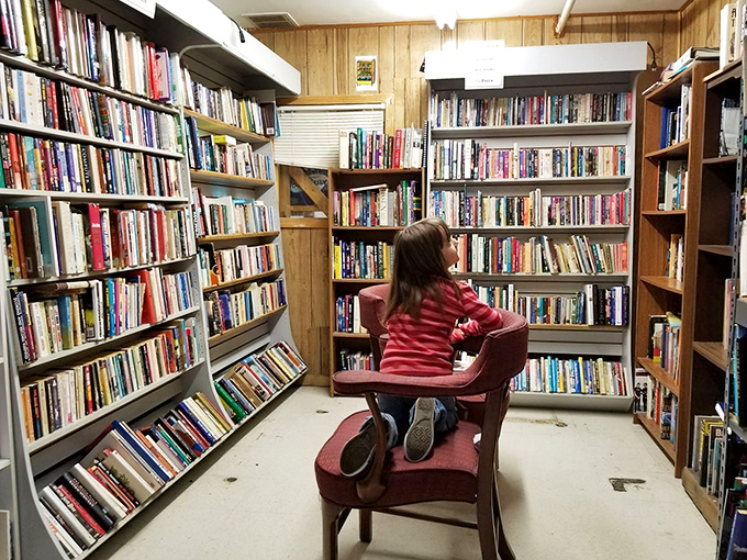 The book section: where time stands still and a young explorer discovers worlds between pages instead of screens.