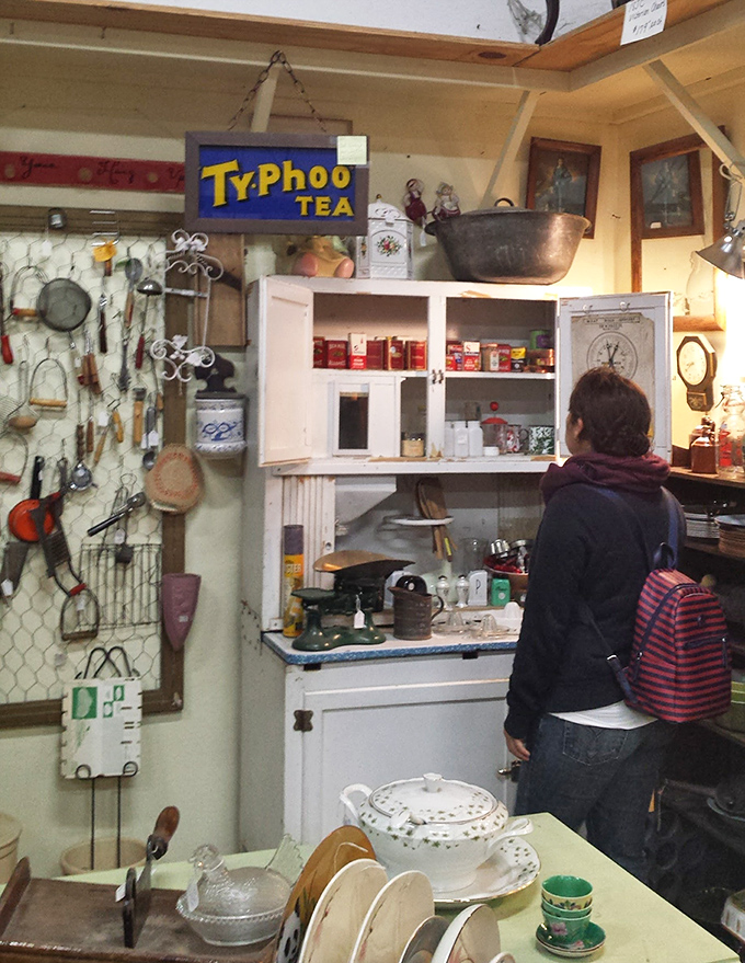 That Typhoo Tea sign watches over a kitchen display that would make Julia Child feel right at home.