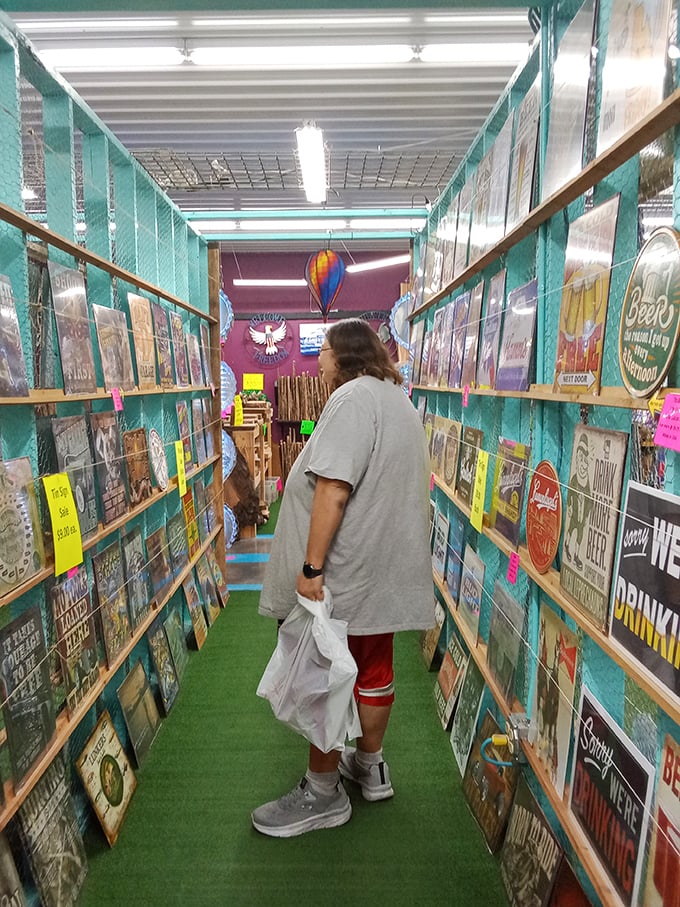 A treasure hunter navigates the nostalgic alley of vintage signs. It's like Pinterest came to life and opened a store!