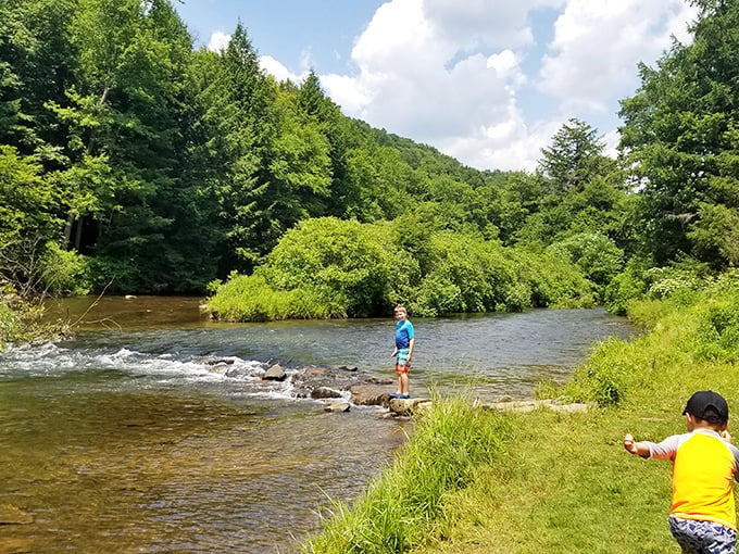 Kids discovering the simple joy of splashing in the river &ndash; childhood as it should be, unplugged and wonderfully wet.