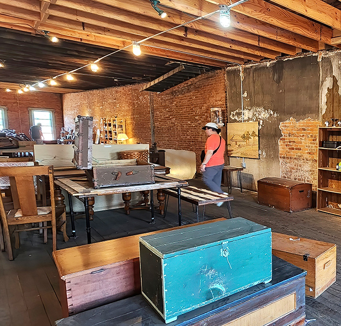 Exposed brick walls and wooden beams create the perfect backdrop for treasure hunting, with each trunk holding potential discoveries.