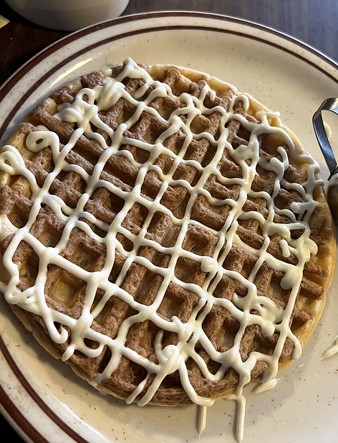 Waffles wearing frosting like a tailored suit. The grid pattern isn't just for show&mdash;it's strategic syrup-catching engineering at its finest.
