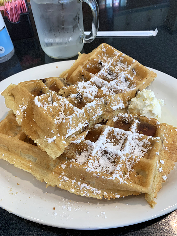 These Belgian waffles aren't just breakfast, they're architecture&mdash;deep pockets perfectly engineered to hold powdered sugar and butter in delicious harmony. 