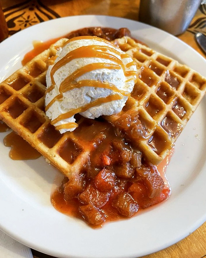Waffles that have clearly gone to finishing school &ndash; perfectly golden, topped with caramelized fruit and whipped cream that's dressed for a special occasion.