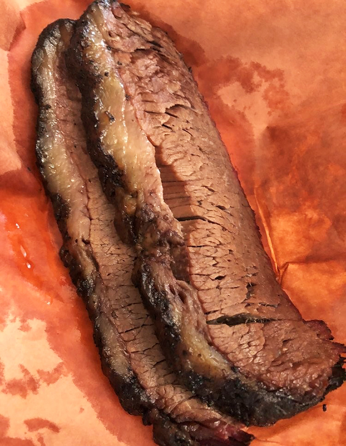 Brisket so perfectly rendered it practically dissolves on contact. That bark is the barbecue equivalent of a perfect crust on artisan bread.