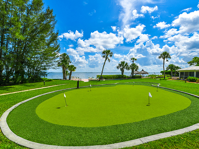 A putting green with a view that makes even terrible golfers forget their score. Water hazard or paradise? Both.