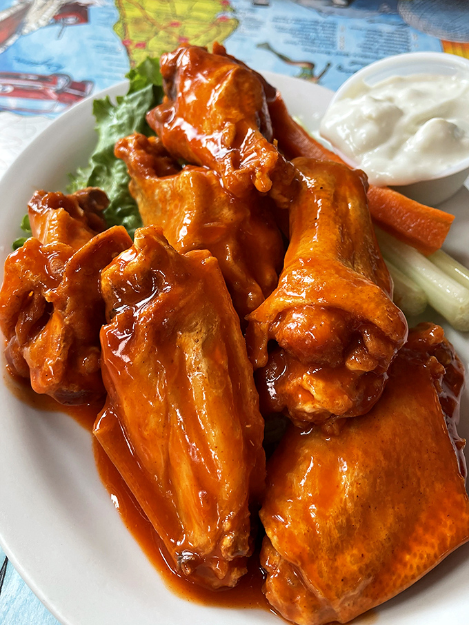 Buffalo wings so glossy they could be on a magazine cover. That sauce isn't just coating chicken&mdash;it's painting a masterpiece.
