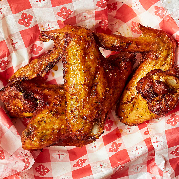 Wings so gloriously burnished they look like they've been sunbathing in flavor, ready to make your taste buds send thank-you notes.
