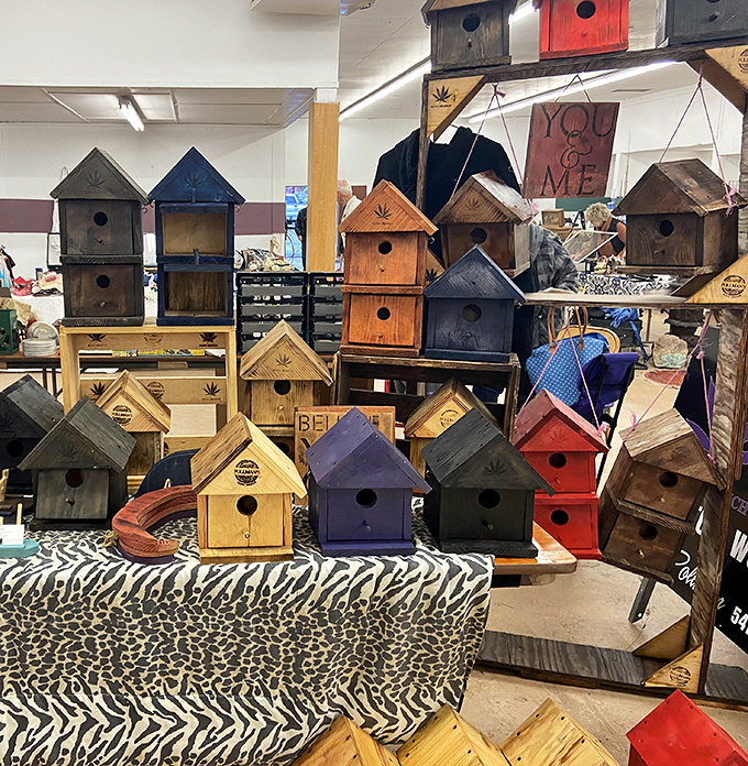 Birdhouse village where feathered real estate dreams come true. From rustic cabins to colorful cottages, there's a perfect avian address for every wing preference. 