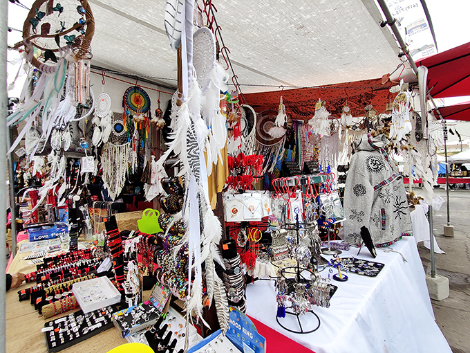 Dreamcatchers and jewelry dangle like possibilities in this accessories booth. One person's tchotchke is another's must-have treasure.