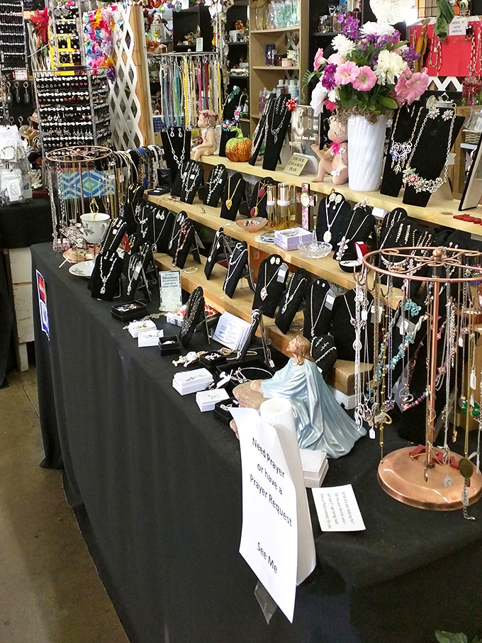 Jewelry displays that would make Elizabeth Taylor pause mid-stride. Each necklace tells a different story, waiting for the right neck to continue its journey.