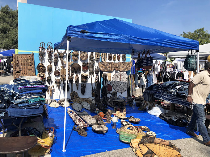 Handwoven baskets and leather goods create an artisan's dream booth that screams authentic craftsmanship.