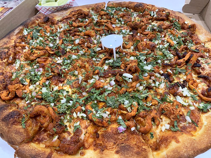 Taco Tuesday meets pizza night! The Al Pastor pizza with its vibrant cilantro and onion topping brings Mexico City flavor to Philadelphia streets.