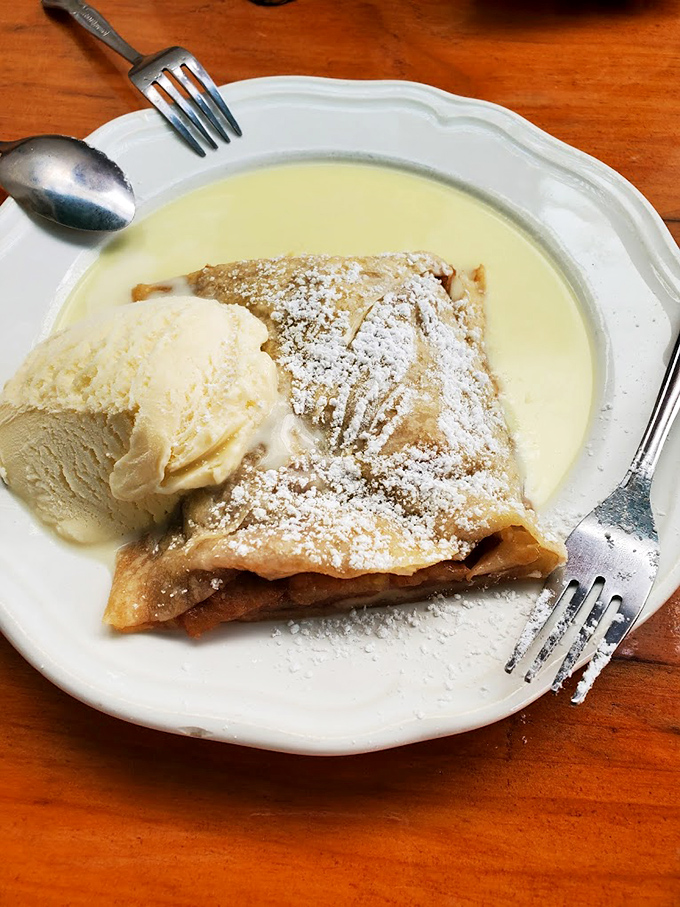 This apple strudel isn't just dessert, it's edible architecture&mdash;layers of flaky pastry, cinnamon-kissed apples, and vanilla ice cream melting into creamy submission.