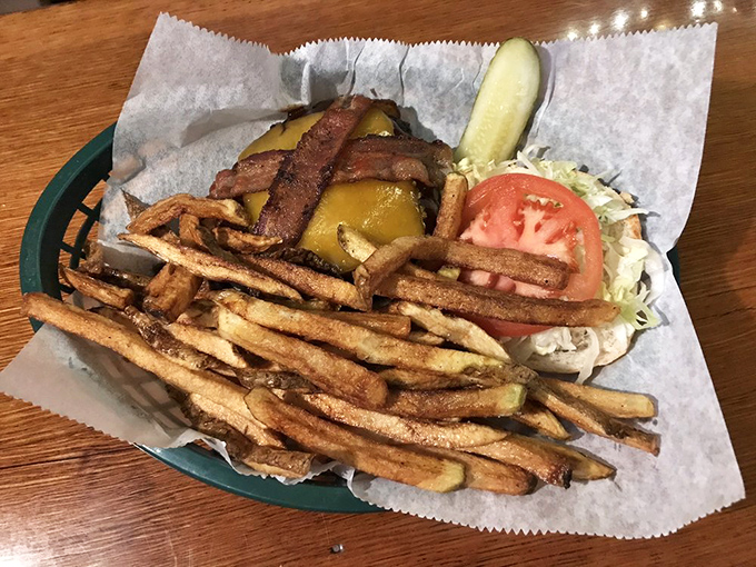 When your burger needs its own zip code and the fries form a golden honor guard around it, you know you've found food worth fighting for.