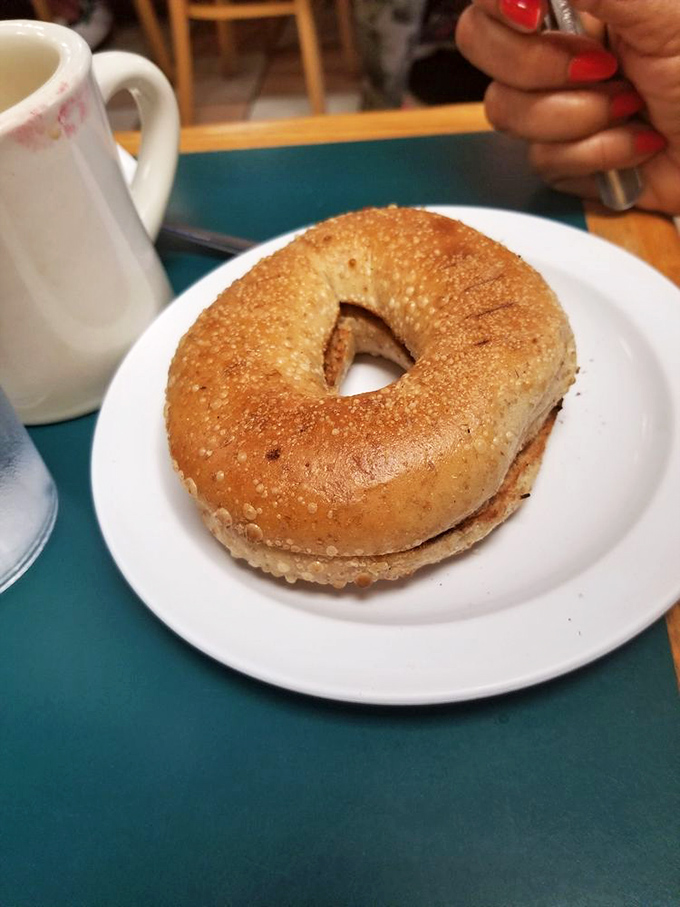 The humble bagel – deceptively simple, notoriously difficult to perfect. This golden specimen has that elusive chewy-crisp balance that makes New Yorkers weep.