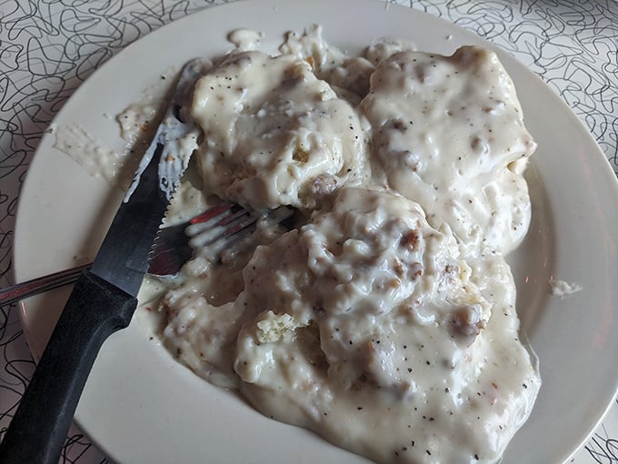 The holy grail of Southern comfort: biscuits drowning gloriously in peppery sausage gravy. Diet plans come here to die happy deaths.