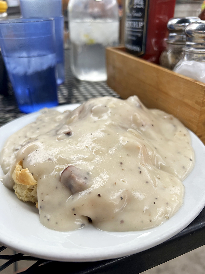 Behold the legendary biscuits and gravy that put Pete's on the map - fluffy clouds drowning in creamy sausage heaven.