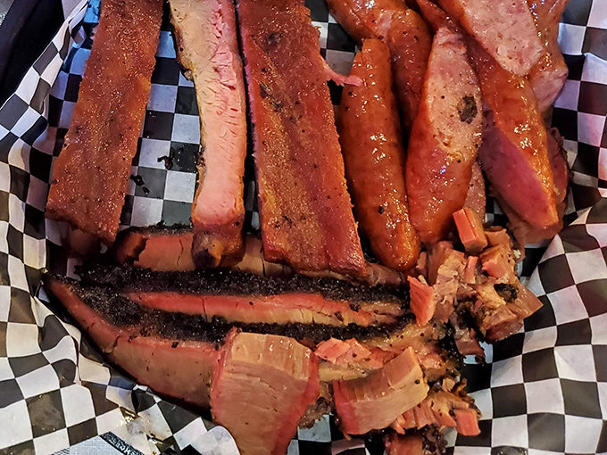 Brisket sliced thick enough to respect tradition, thin enough to appreciate texture. That smoke ring is nature's way of saying "good things come to those who wait."