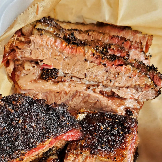 The telltale pink smoke ring on this brisket is like a diploma from BBQ University. Hours of patient smoking transformed this tough cut into buttery perfection.