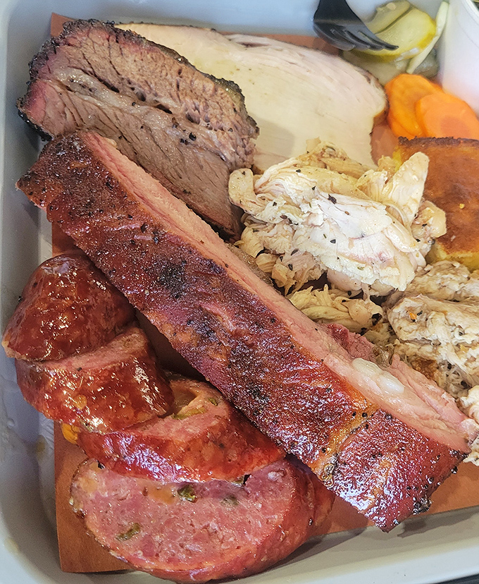 Brisket so tender it practically surrenders to your fork. Those glistening slices have been slow-dancing with smoke for hours.