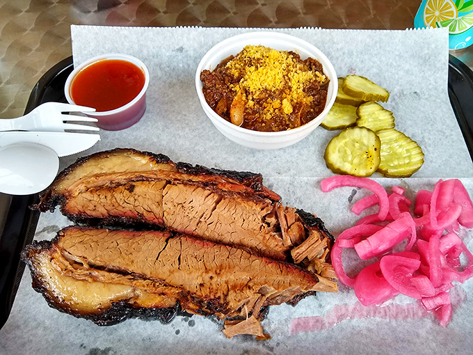 Brisket with bark so beautiful it belongs in a museum, paired with chili that could make a Texan weep with joy.
