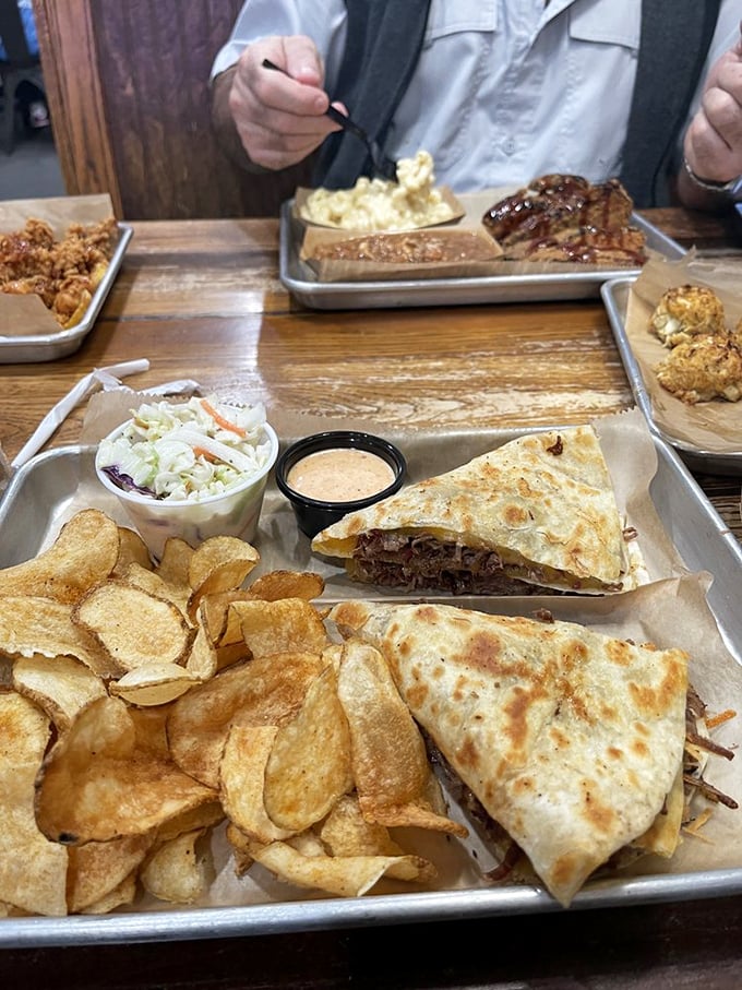 Quesadillas reinvented with smoky brisket that melts slower than your resistance. Paired with those house-made chips, it's a combo that demands your full attention.