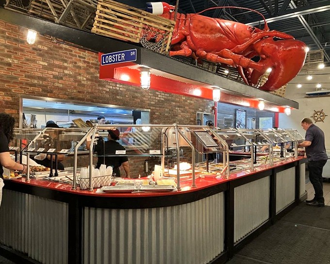 Beneath that magnificent red lobster sentinel, the buffet line stretches like a seafood lover's yellow brick road to paradise.
