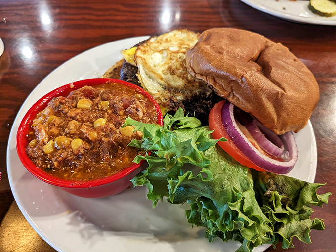 This isn't just a burger—it's an edible architecture project. The chili side dish brings that slow-simmered Southern comfort that makes you want to hug your plate.