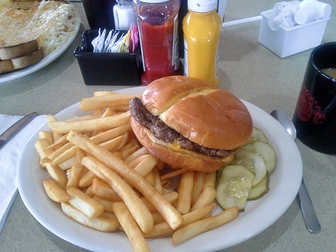 The burger and fries combo that launched a thousand road trips. Simple, honest, and exactly what you want when the hunger hits – note those perfectly golden fries.