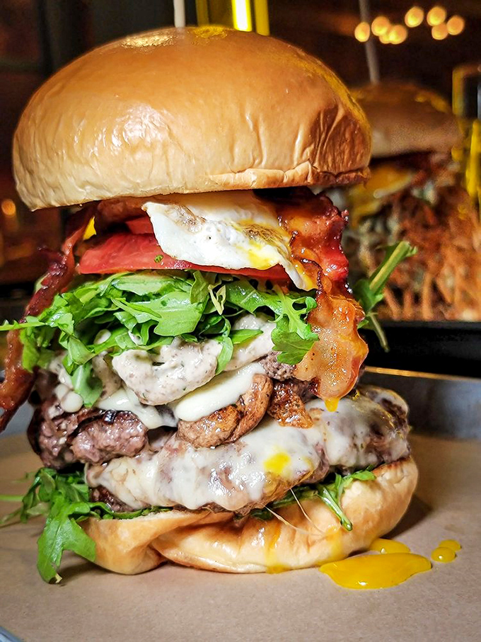 Behold the architectural marvel that is Burgermeister's signature creation. Like the Sagrada Familia of sandwiches, it's still under construction but already a masterpiece.