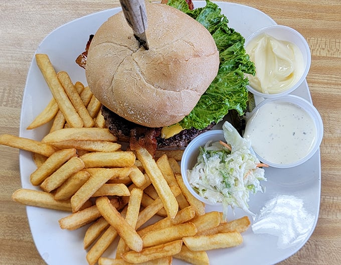 This isn't just a burger&mdash;it's architecture. Stacked high with all the fixings and surrounded by a golden battalion of perfectly crisp fries.