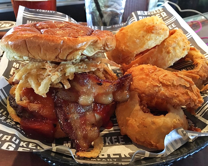 Golden onion rings alongside a perfect burger create the kind of harmony that makes hearts sing.