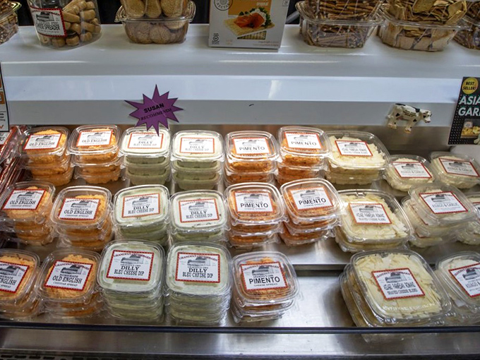 The cheese case at Grandpa's isn't just a display—it's a gallery of dairy masterpieces, each container holding possibilities limited only by your cracker supply.