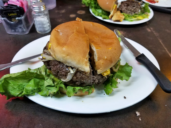 This isn't some fancy gastropub creation &ndash; it's an honest-to-goodness burger that would make your cardiologist wince and your taste buds sing. 