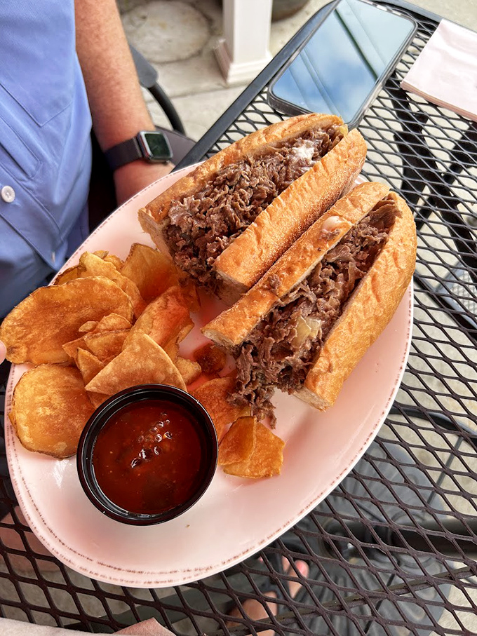 The sandwich that launched a thousand return visits &ndash; pulled meat piled high with house chips standing guard.