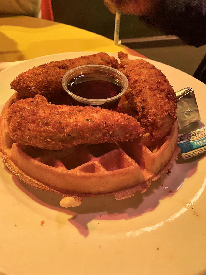 Whoever decided to pair crispy fried chicken with fluffy waffles deserves a Nobel Prize in Breakfast Sciences. The maple syrup seals the deal.
