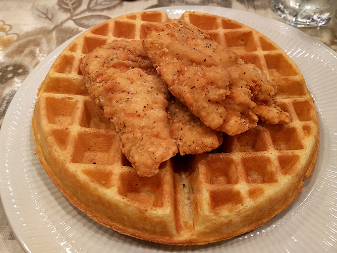 Chicken and waffles: where breakfast and lunch stop fighting and fall in love. That perfect golden waffle grid is engineering at its tastiest.