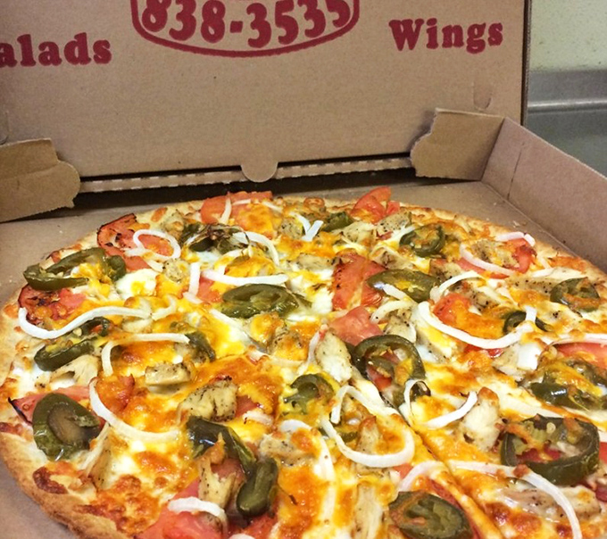 Like a good marriage, this pizza proves opposites attract—spicy jalapeños, cool onions, and savory chicken finding harmony under a blanket of melted cheese.