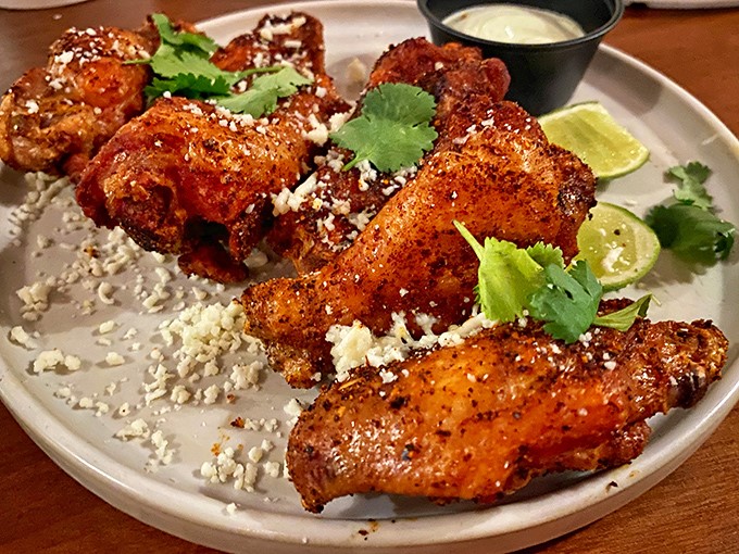 These wings aren't just tossed in sauce &ndash; they're dressed for the prom with queso fresco, lime, and cilantro in a cross-cultural flavor explosion.