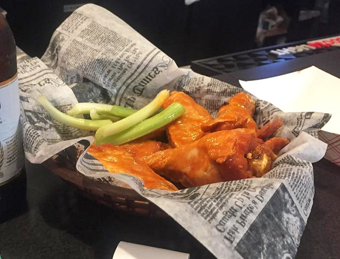 These aren't just wings; they're crispy, saucy little miracles served with the traditional celery sticks&mdash;nature's way of pretending you're eating something healthy.