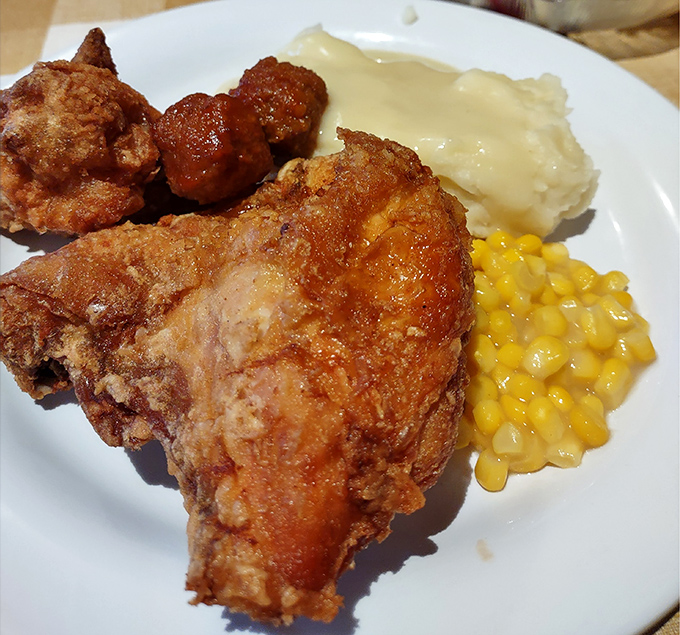 This isn't just fried chicken; it's a masterclass in crispiness with sides that know their supporting role perfectly.
