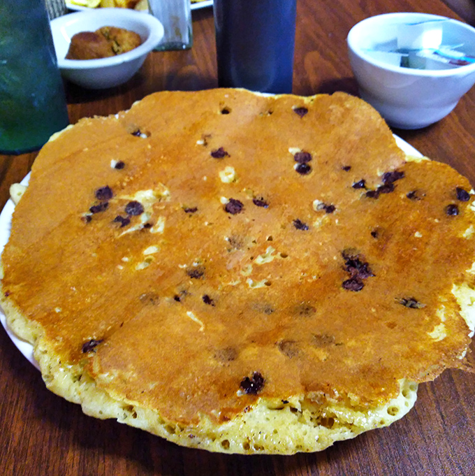 Chocolate chip pancakes the size of small planets. The only question is whether to use the fork or just dive in face-first.