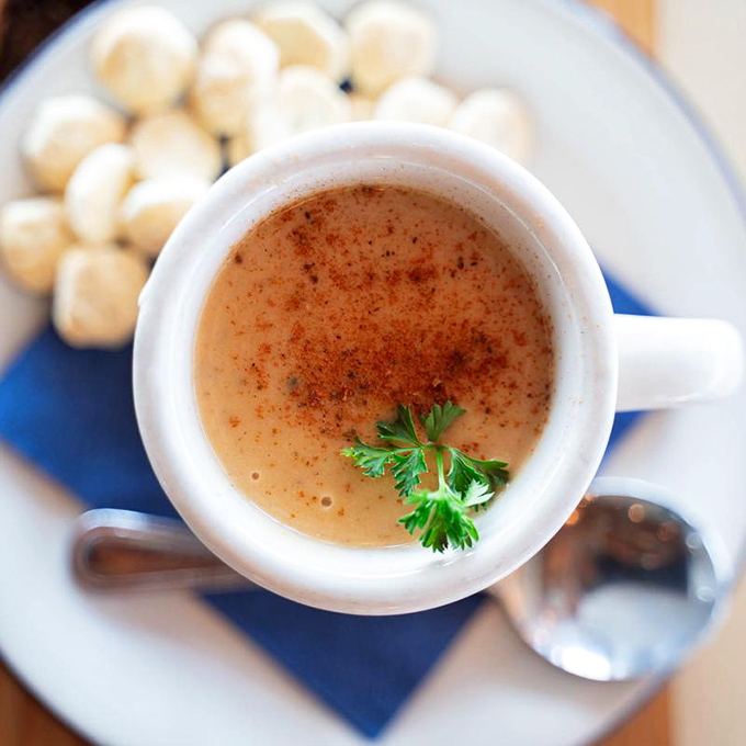 A mug of clam chowder that whispers, "Sit down, take a breath." Comfort in a cup, with oyster crackers standing by.