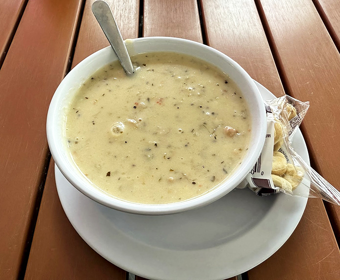 This creamy bowl of coastal comfort warms souls like a lighthouse beacon on stormy nights.